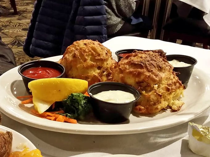 Behold the holy grail of Maryland cuisine—jumbo lump crab cakes with minimal filler, maximum flavor, and the kind of golden crust that makes you pause in reverence.