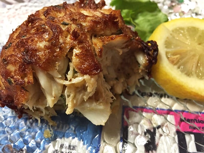 The legendary crab cake in all its glory—more crab than cake, bronzed to perfection, and worth every mile of your journey.