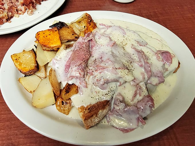 Creamed chipped beef that would make your grandmother weep with joy, served alongside home fries that achieve the perfect crisp-to-tender ratio.