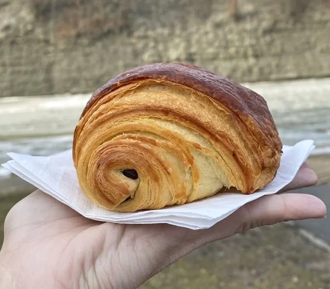 Behold the humble croissant in its natural glory—architectural perfection that makes you wonder if butter should be classified as a controlled substance.