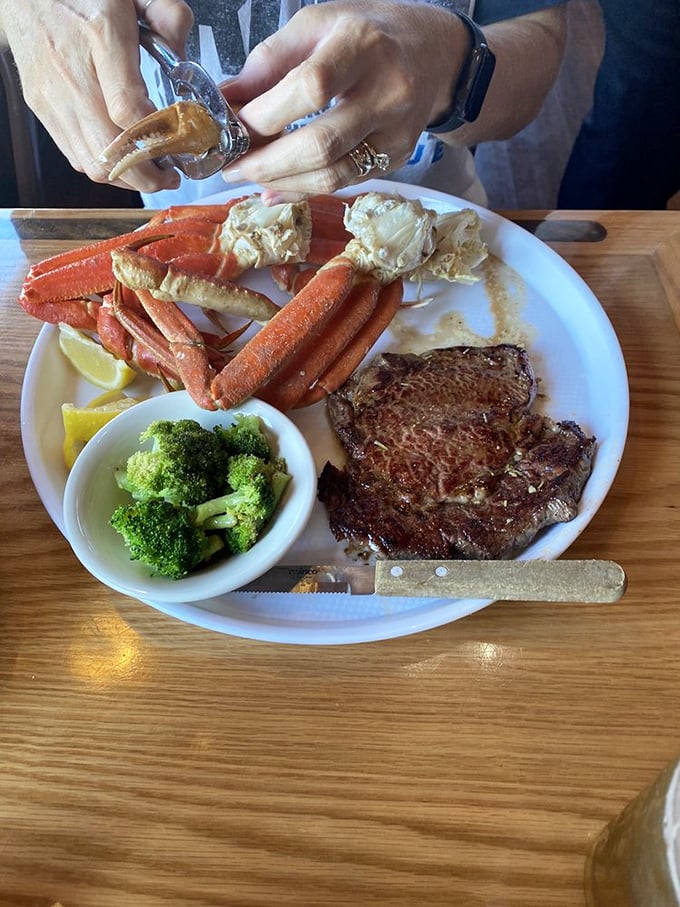 Surf meets turf in perfect harmony. Those snow crab legs aren't just showing off—they're practically begging you to grab the shell crackers.