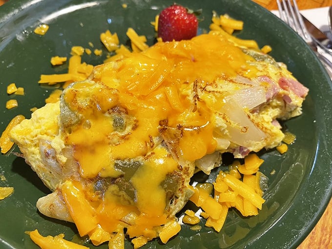 This isn't just an omelet—it's a cheese-draped masterpiece that makes you wonder why we don't put melted cheddar on everything in life.