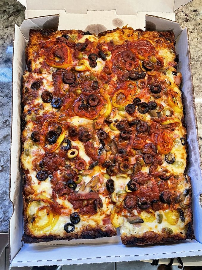This isn't just pizza; it's Detroit history in edible form. The caramelized cheese edge is the culinary equivalent of striking gold.
