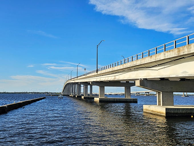 The Edison Bridge spans the Caloosahatchee River, connecting Fort Myers to adventures that don't require dipping into your grandkids' college fund.