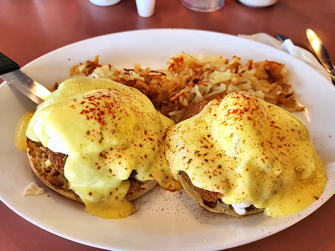 Behold the star of our show—Eggs Benedict with perfectly poached eggs wearing their hollandaise coats like sunshine-colored royalty.