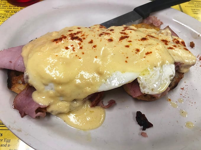 Behold the Eggs Benedict that's causing traffic jams on I-94 – perfectly poached perfection drowning in golden hollandaise.