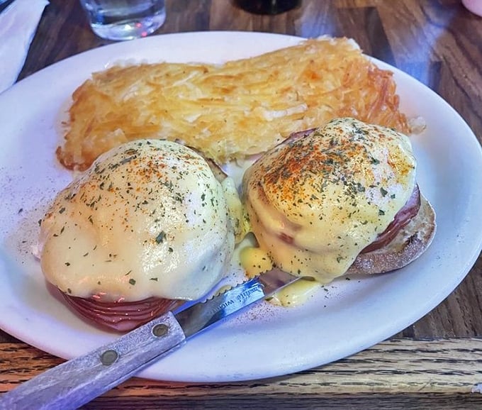 Eggs Benedict done right – when hollandaise flows like liquid gold over perfectly poached eggs.
