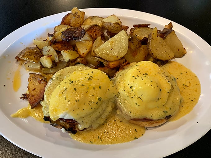 Behold the star attraction: Eggs Benedict with perfectly poached eggs and hollandaise that cascades like a golden waterfall over English muffins.