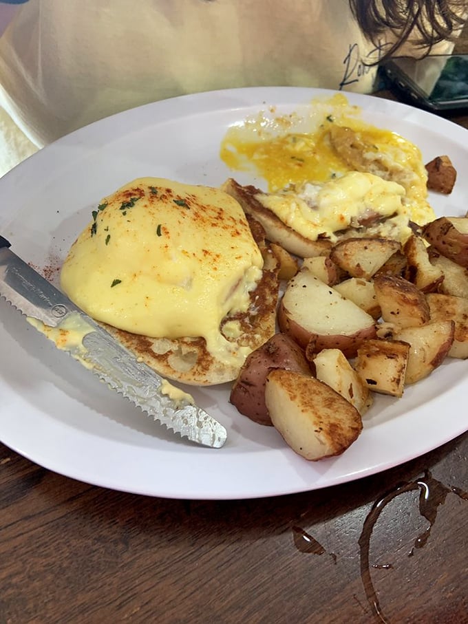 Eggs Benedict gets the Southern treatment with perfectly poached eggs and hollandaise that practically glows. Those home fries aren't just a side dish—they're a supporting actor worthy of an Oscar.