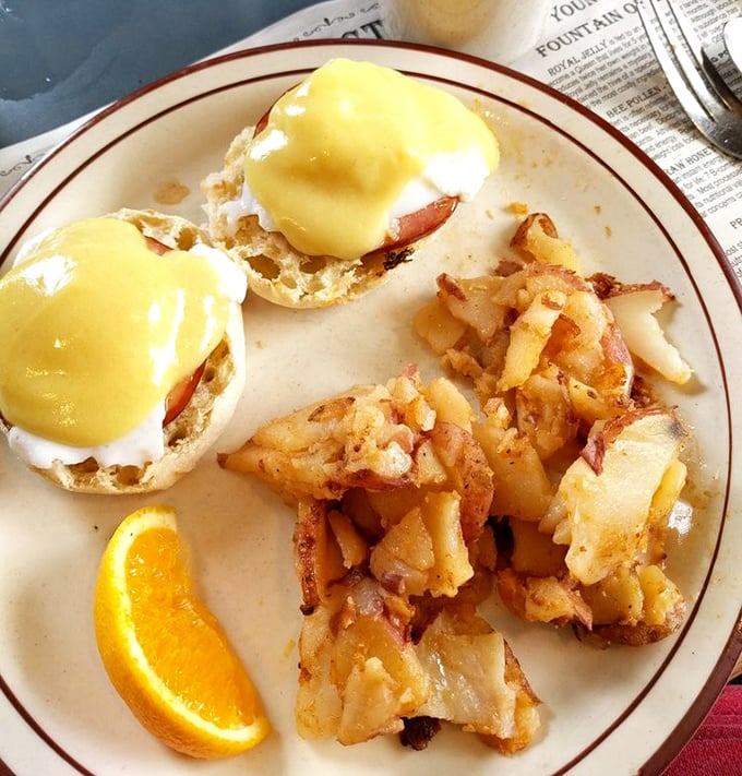 Eggs Benedict that would make the Pope jealous. Those home fries look like they've achieved the perfect crisp-to-tender ratio—a culinary miracle.