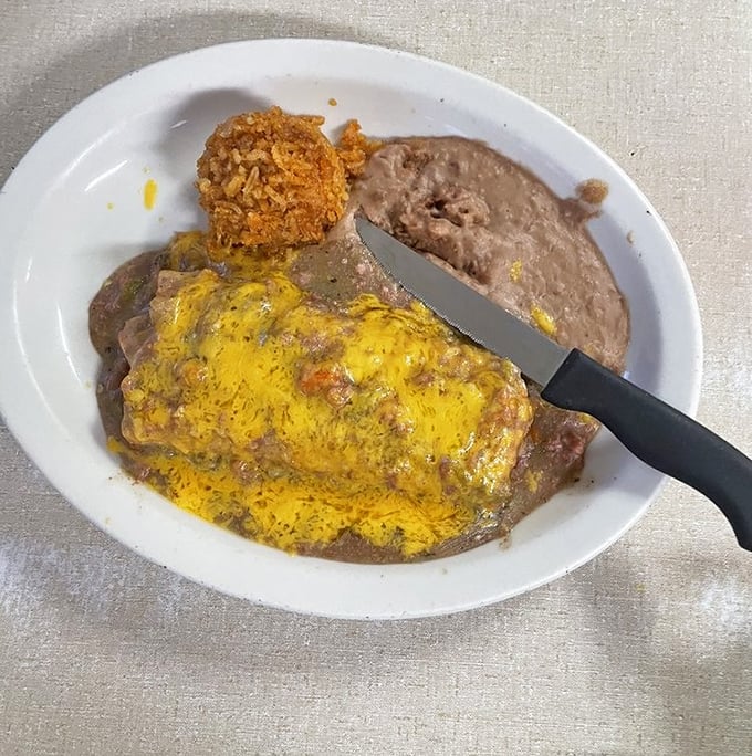 This enchilada plate isn't just food; it's edible geography—a perfect representation of Arizona's culinary heritage smothered in melted cheese and authentic sauce.