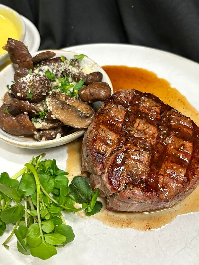 Behold the star of the show—a perfectly seared filet mignon resting in its own juices, accompanied by mushrooms that clearly got the VIP treatment.