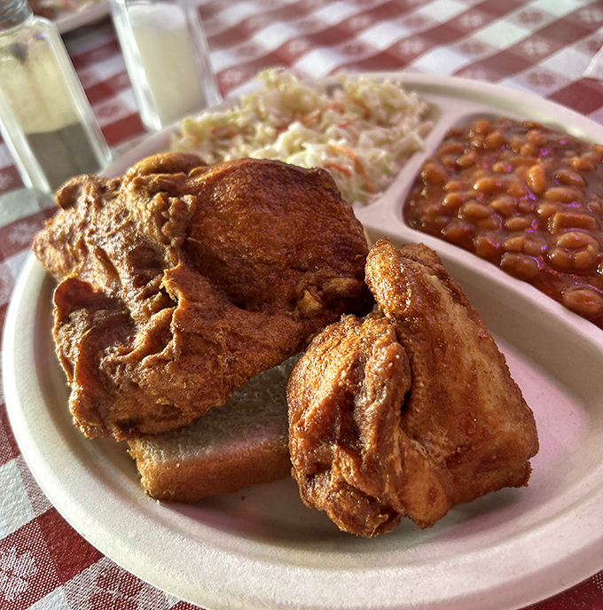 The holy grail of fried chicken – that mahogany crust holding secrets older than most Kentucky bourbon. Worth crossing state lines for.