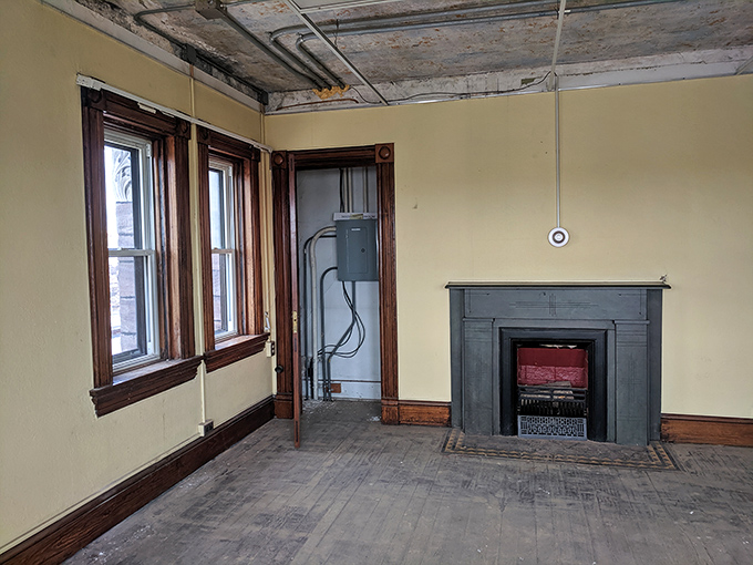 Even Victorian-era jails needed a touch of home. This sparse room with its lonely fireplace reminds us that comfort was a relative concept in penal history.