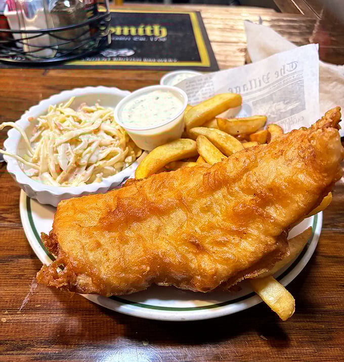 Golden, flaky, and larger than the plate it sits on—this fish practically begs you to break through its crispy armor to the tender cod within.