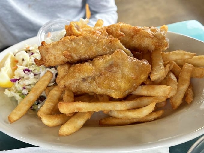Golden-battered fish that shatters with each bite, paired with perfectly crisp fries. This isn't just fish and chips—it's an edible postcard from the Pacific.