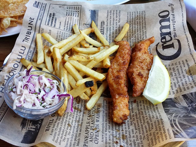 Fish and chips that would make a British pub jealous. That perfect crunch gives way to flaky white fish—a maritime miracle wrapped in golden batter.