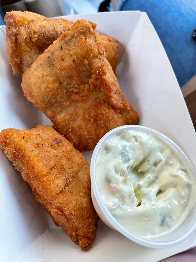 Golden triangles of perfectly fried fish with creamy tartar sauce – a crispy-on-the-outside, tender-on-the-inside masterpiece worth crossing town for.