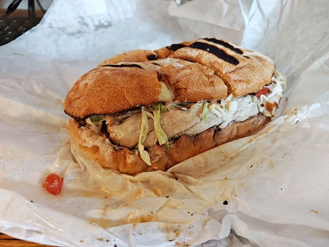 This isn't just a sandwich; it's architecture of flavor—perfectly grilled fish nestled between toasted bread that's earned its legendary status.