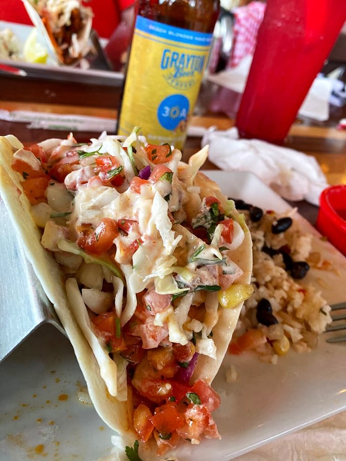 This isn't just a fish taco – it's edible architecture where each layer plays its perfect part. The slaw crunch seals the deal.