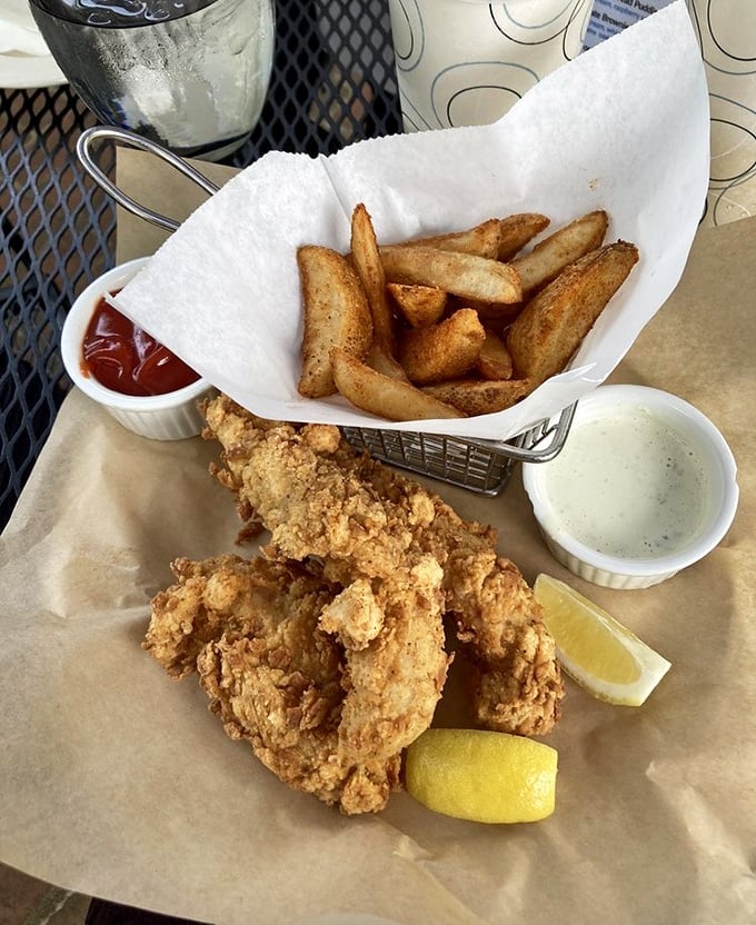 Golden-fried perfection meets potato wedges in this basket of fish and chips—proof that sometimes the simplest pleasures are the most satisfying.