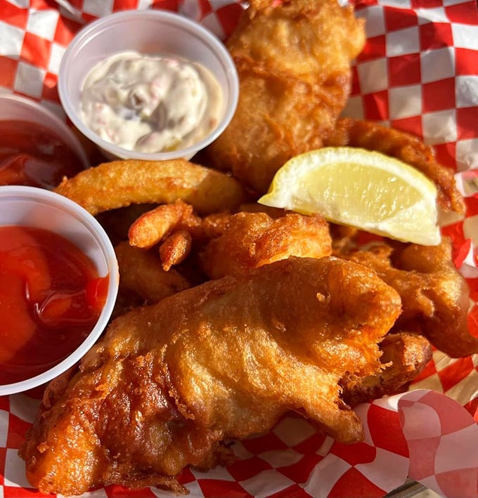 Golden-battered fish that shatters with each bite, paired with crispy fries and house-made sauces—proof that perfection needs no garnish.