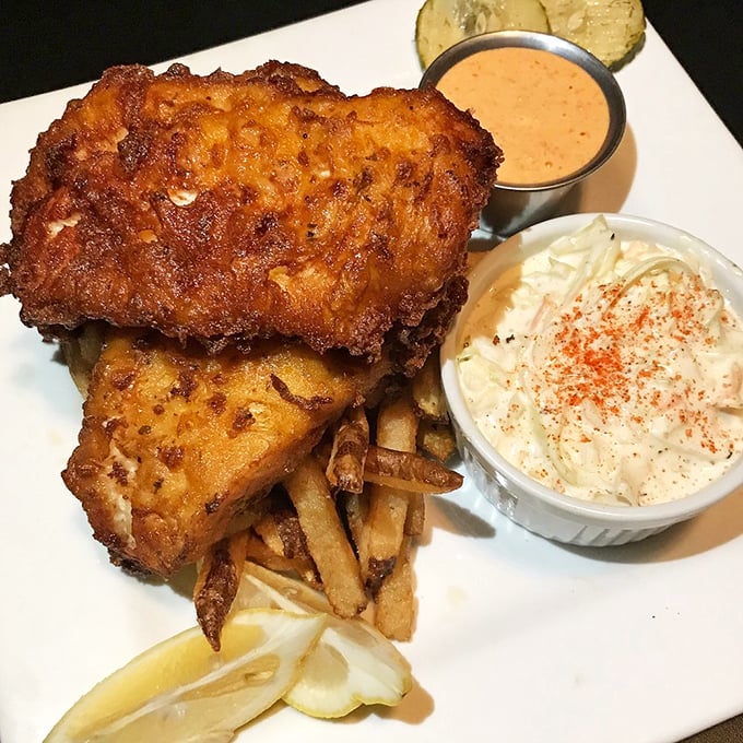 Golden-battered haddock that shatters at first bite, served with hand-cut fries and house-made coleslaw – this is what food dreams are made of.