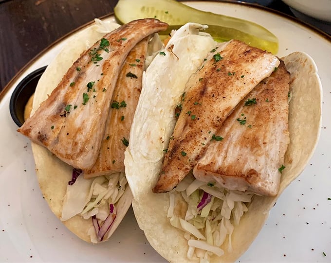 These aren't just fish tacos – they're an edible masterpiece of perfectly grilled fish, crisp slaw, and soft tortillas that might make you weep with joy.