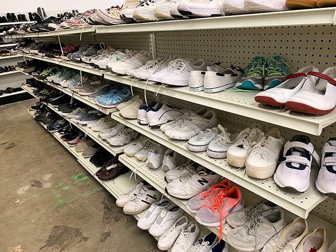 Sneaker heaven awaits the patient thrifter. Rows of barely-worn athletic shoes and casual footwear stand ready for their second chance at sidewalk stardom.