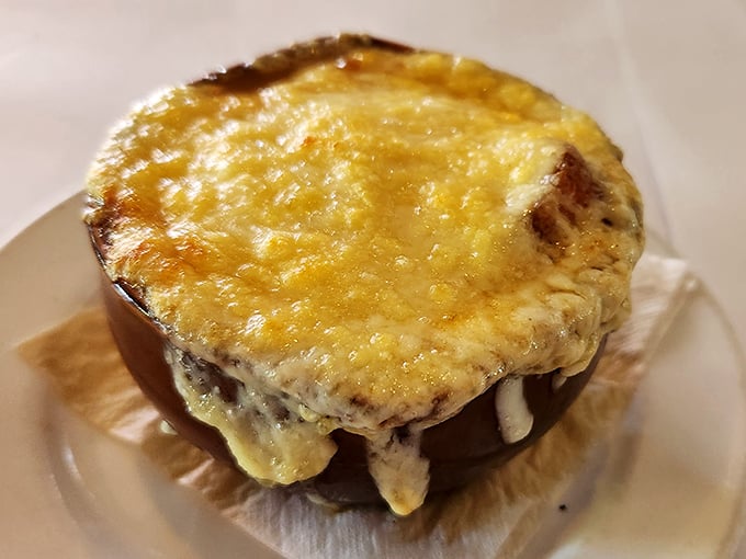 This isn't just French onion soup – it's a cheese-crowned masterpiece that makes you want to stand up and sing La Marseillaise between spoonfuls.