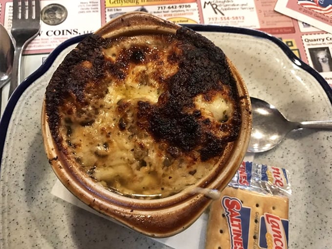 The legendary French onion soup in all its glory – that cheese pull could win Olympic medals. A bubbling cauldron of savory satisfaction worth crossing county lines for.