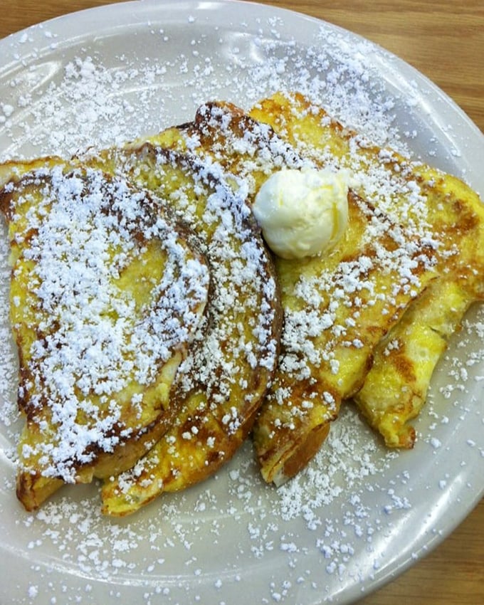 Golden, custardy French toast dusted with powdered sugar and topped with a melting pat of butter—breakfast perfection doesn't need to be complicated.