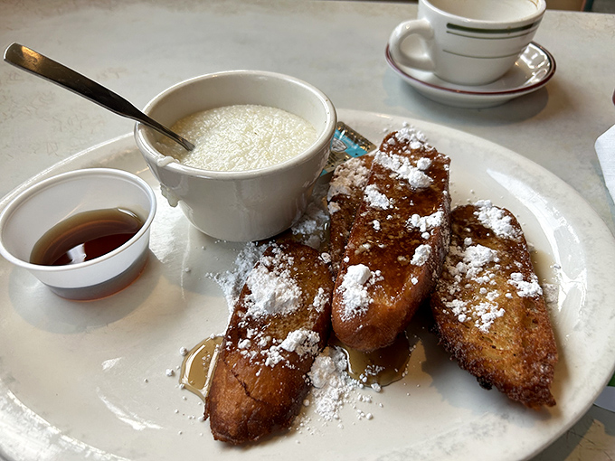 Golden-brown French toast dusted with powdered sugar snow – this isn't breakfast, it's edible nostalgia that makes you want to hug your plate.