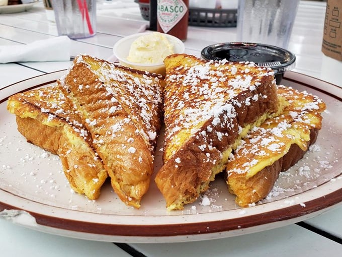 The French toast that launched a thousand return visits. Golden, crispy exterior giving way to a custard-like center—this is breakfast nirvana.