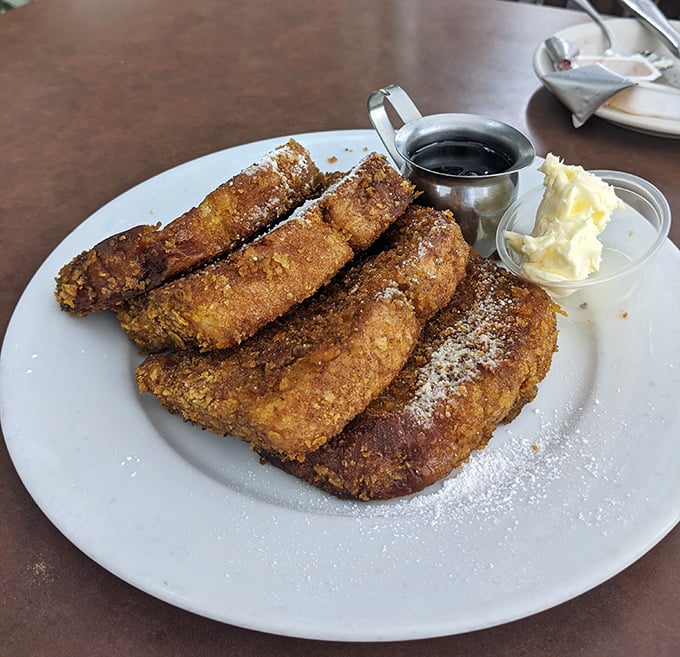 The legendary Fantastic French Toast—cornflake-crusted sourdough that's crispy outside, custardy inside—is basically breakfast wearing a tuxedo and ready to dance.