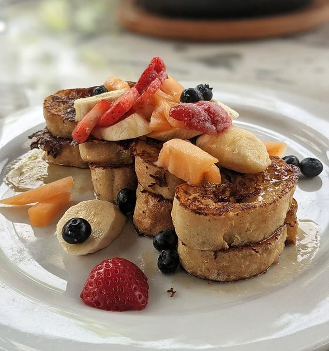 This French toast isn't just breakfast – it's a revelation. Golden-brown perfection topped with fresh berries that pop with every heavenly bite.