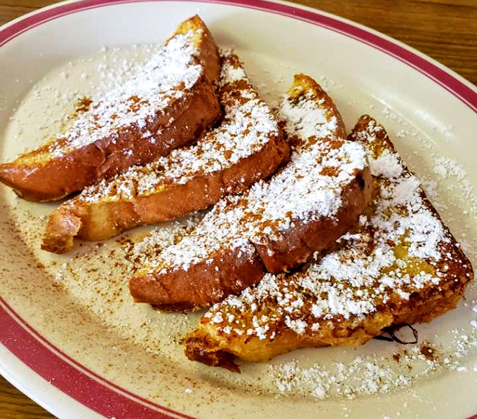 French toast that's dressed for success. Powdered sugar snow meets cinnamon warmth in a breakfast that makes Monday mornings bearable again.