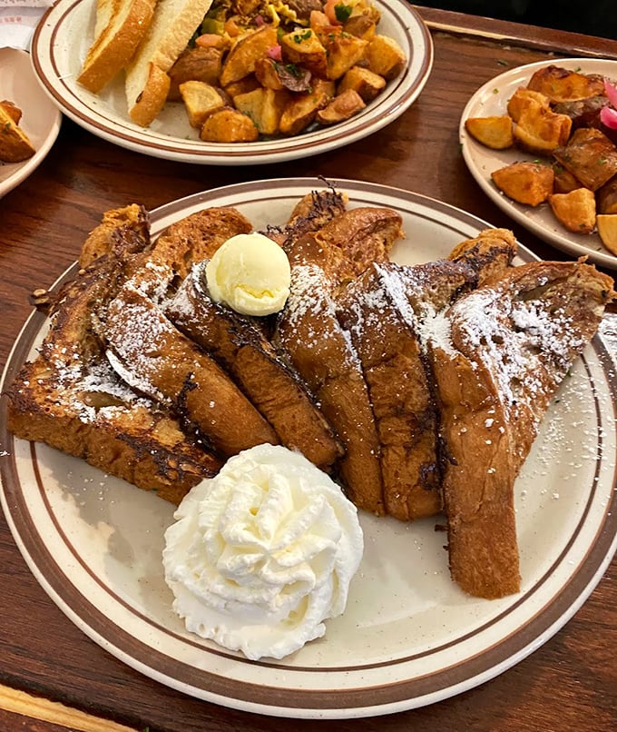 French toast that doesn't just flirt with decadence—it's in a full-blown relationship. That dollop of butter slowly melting is practically food poetry.