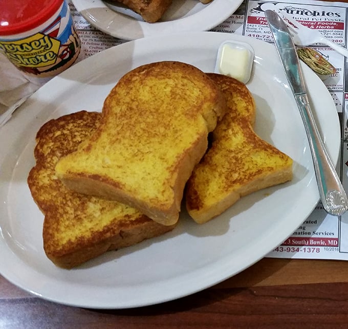 Golden-hued French toast that's achieved that mythical balance – crispy edges giving way to a custardy center that makes time stand still.