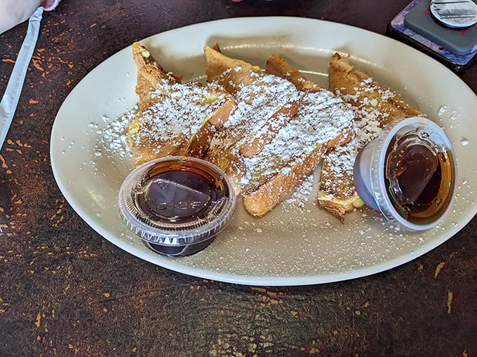 French toast that doesn't need a social media strategy to be successful—just powdered sugar, syrup, and the kind of golden-brown perfection that makes mornings worthwhile.