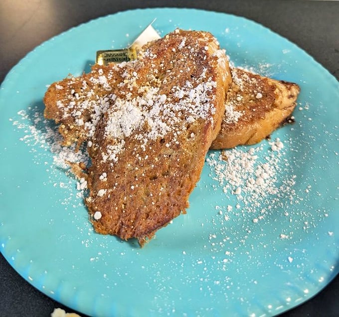 Golden-brown French toast dusted with powdered sugar – simple perfection that doesn't need fancy garnishes to shine.