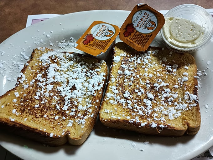 Behold the French toast in all its glory – dusted with powdered sugar and waiting for that maple syrup cascade. Breakfast nirvana achieved!