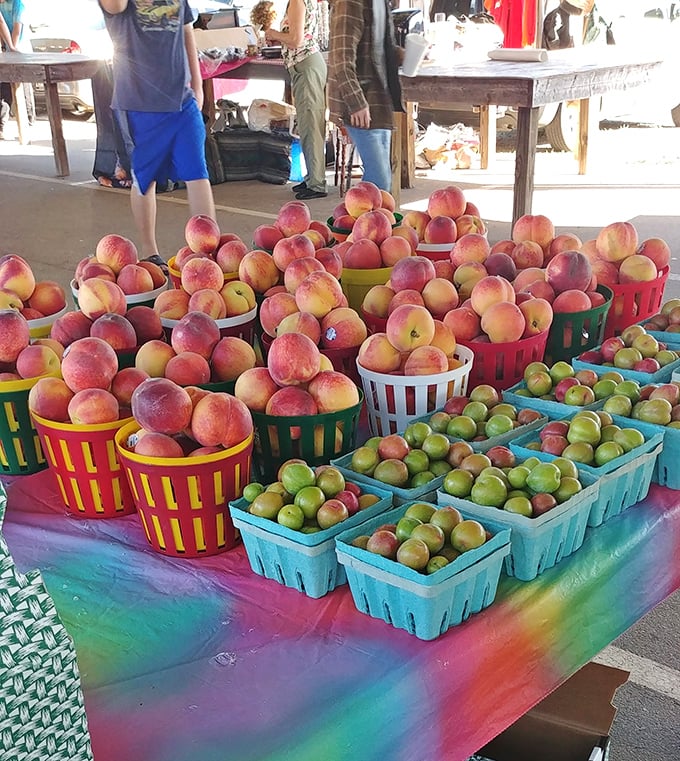Summer's bounty displayed in technicolor glory. These South Carolina peaches and apples aren't just fruit—they're edible sunshine waiting to be taken home.