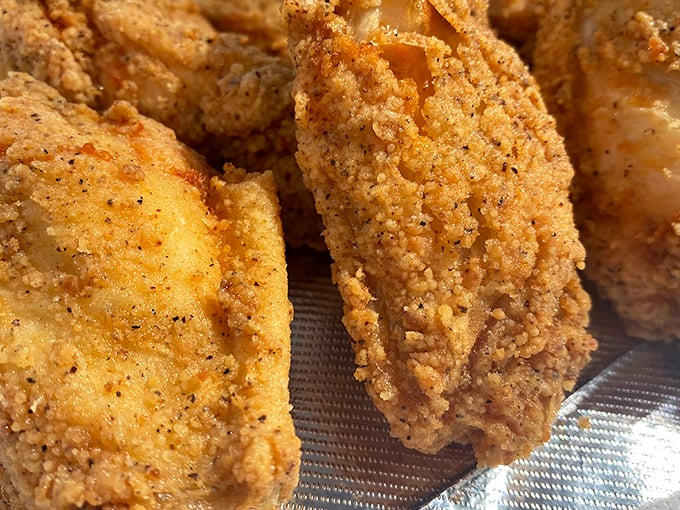 Golden-brown perfection that shatters with each bite – this isn't just fried chicken, it's edible sunshine with a crispy crust.