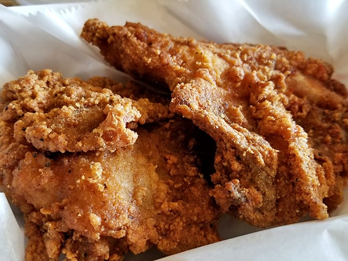 Golden-brown perfection that makes time stand still. This isn't just fried chicken—it's edible poetry with a crunch that echoes through Western Pennsylvania.