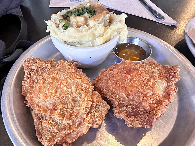 Golden-brown perfection meets cloud-like mashed potatoes. This plate doesn't just speak to your stomach—it serenades it with a country ballad.