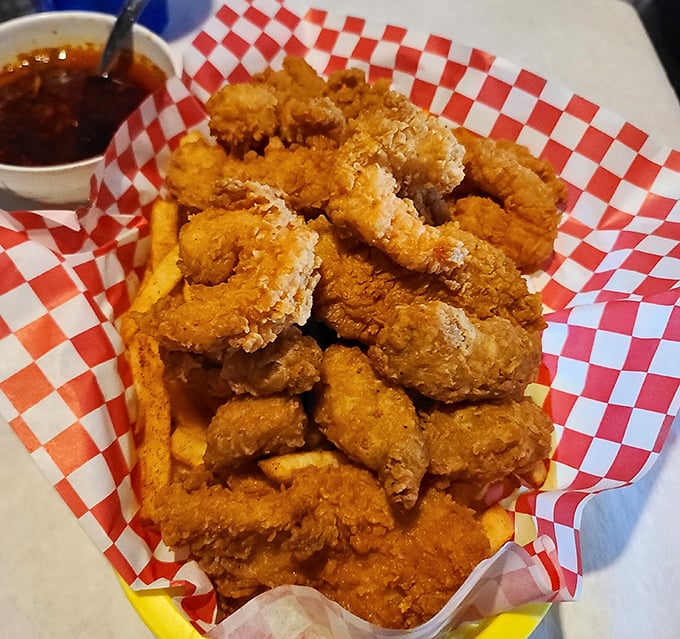 Golden-fried shrimp that crunch like autumn leaves—a basket of crispy perfection waiting for its dip in tangy sauce.