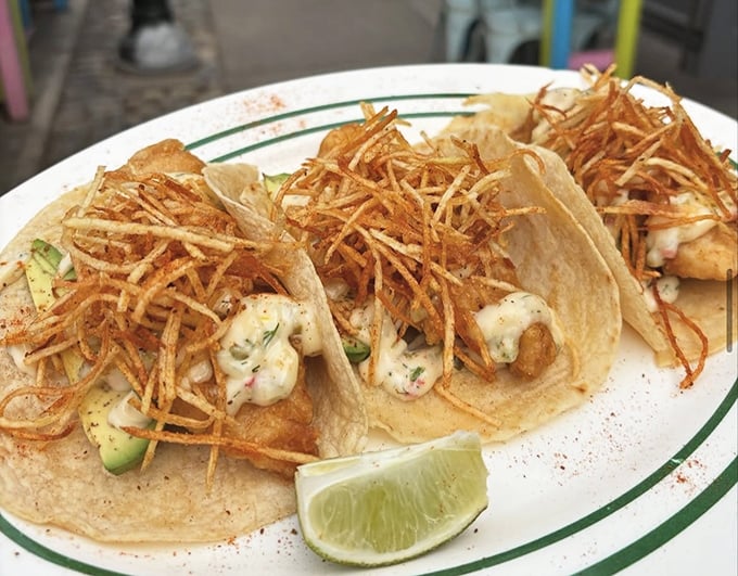 These shrimp tacos aren't just topped with crispy straws—they're wearing little flavor hats that add the perfect crunch to each heavenly bite.