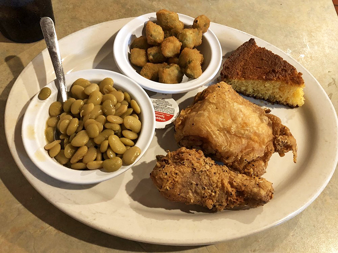 Southern fried chicken that's audibly crunchy on the outside, juicy on the inside. Paired with lima beans and cornbread, it's a plate of pure Florida comfort.
