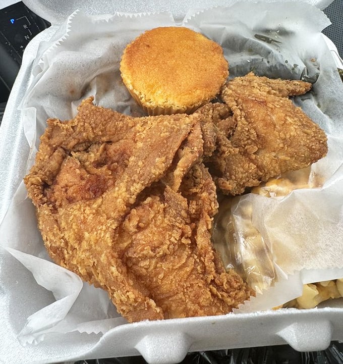 Golden-brown fried chicken with a cornbread sidekick – this isn't just food, it's edible artwork that crackles with each heavenly bite.